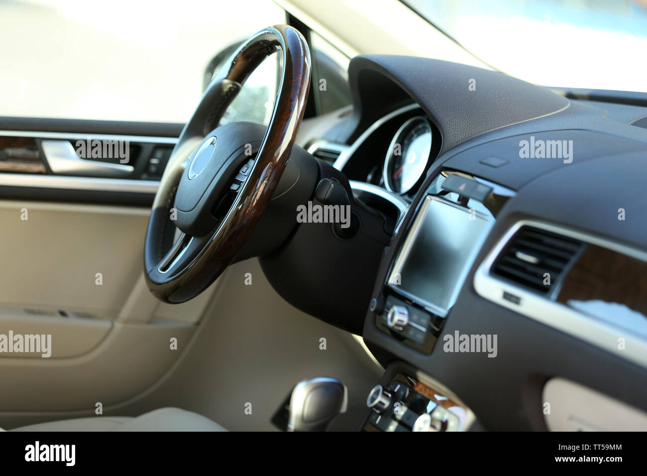 Interior view of car with beige salon and black dashboard Stock Photo ...