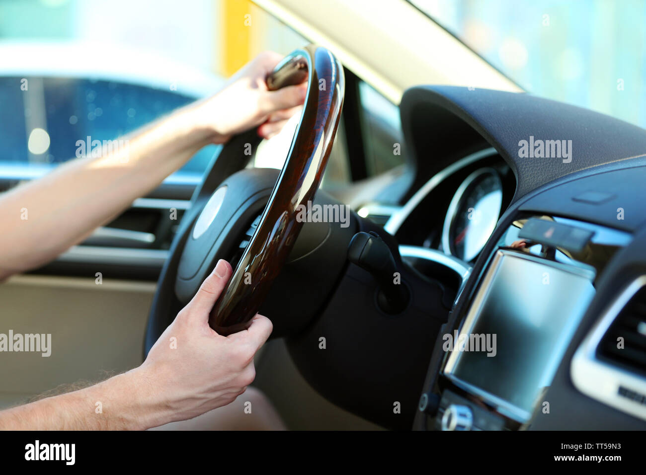 Man's hands on a steering wheel Stock Photo - Alamy