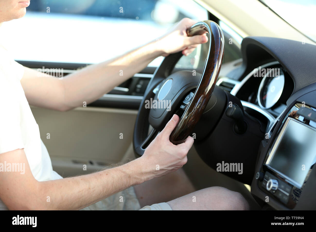 Man's hands on a steering wheel Stock Photo - Alamy