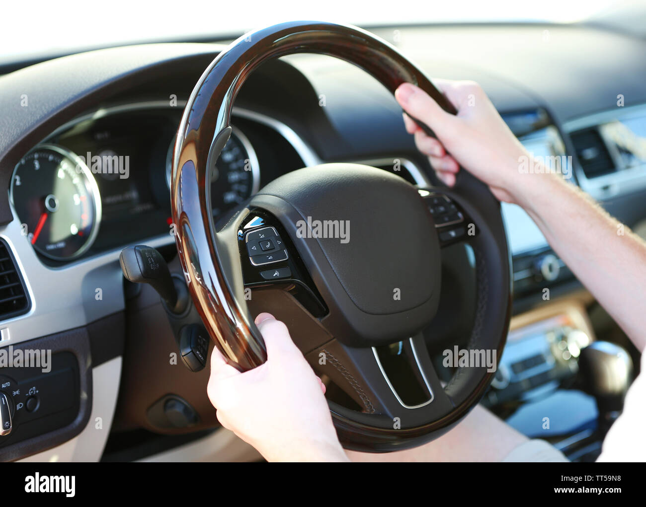 Man's hands on a steering wheel Stock Photo - Alamy