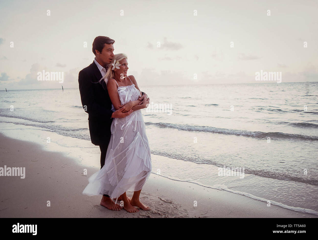 Beautiful couple on the beach celebrating their marriage Stock Photo ...