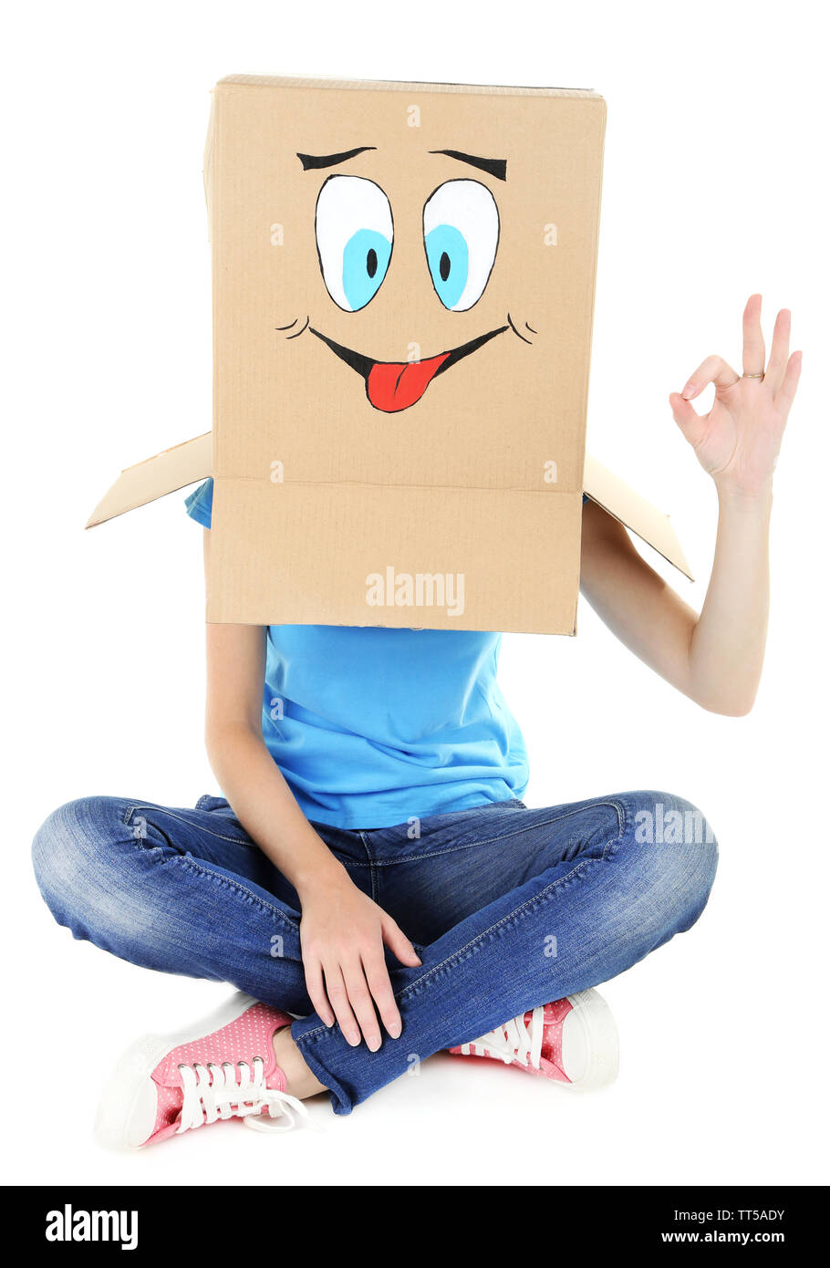 Woman with cardboard box on her head with happy face, isolated on white ...