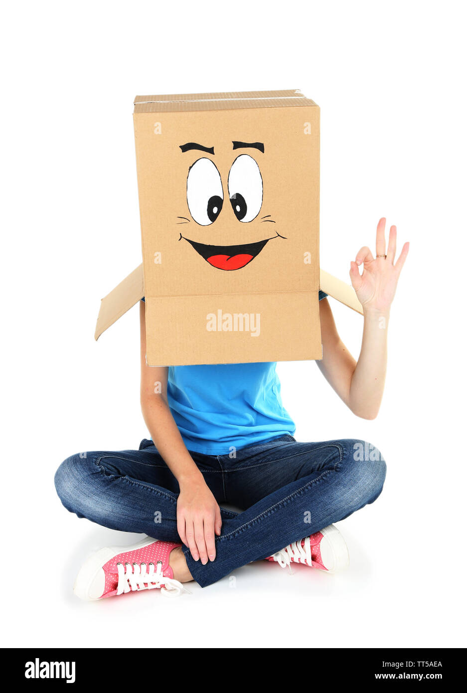 Woman with cardboard box on her head with happy face, isolated on white ...