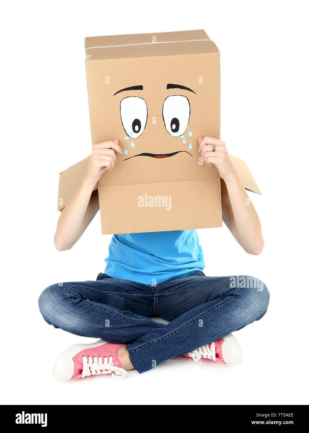 Woman with cardboard box on her head with sad face, isolated on white ...