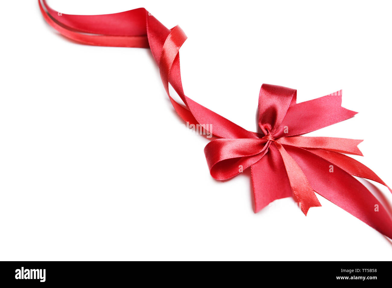 Shiny red ribbon with bow isolated on white Stock Photo - Alamy