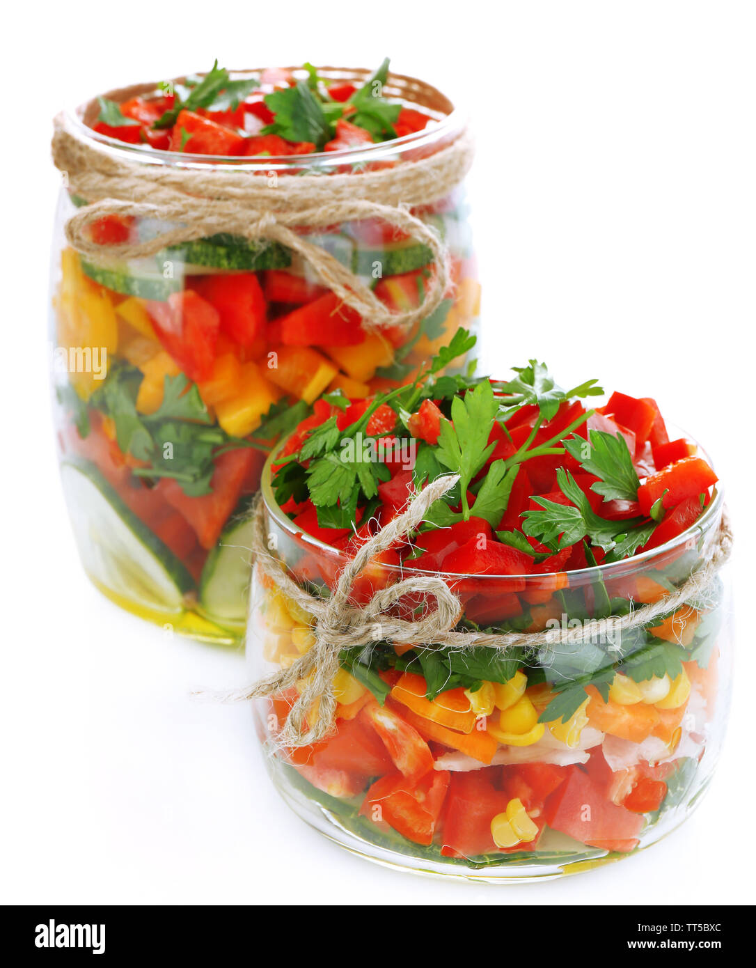 Vegetable salad in glass jars, isolated on white Stock Photo - Alamy
