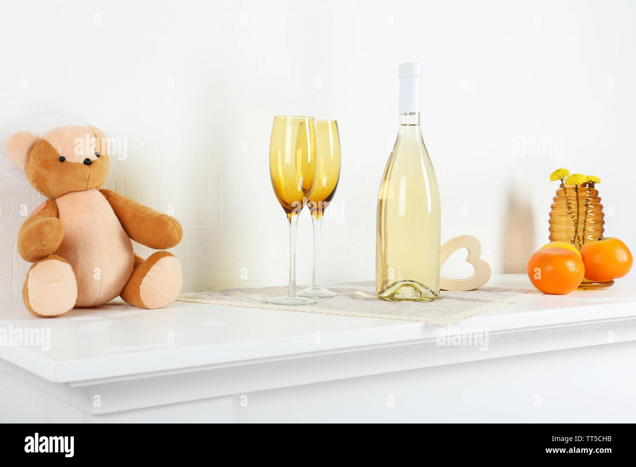 Different objects on white shelf in living room Stock Photo - Alamy