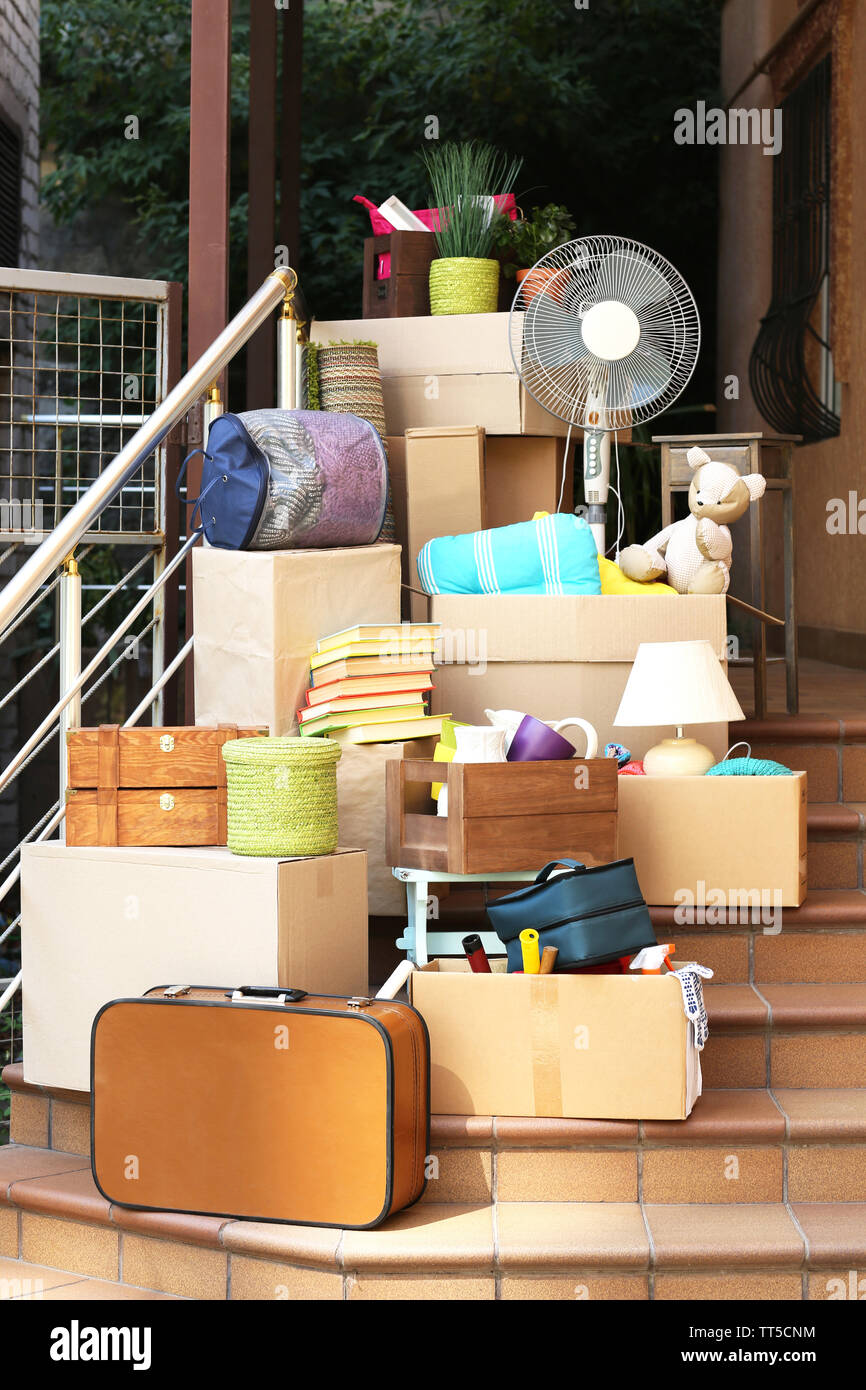 Moving boxes on stairs of new house, outdoors Stock Photo - Alamy