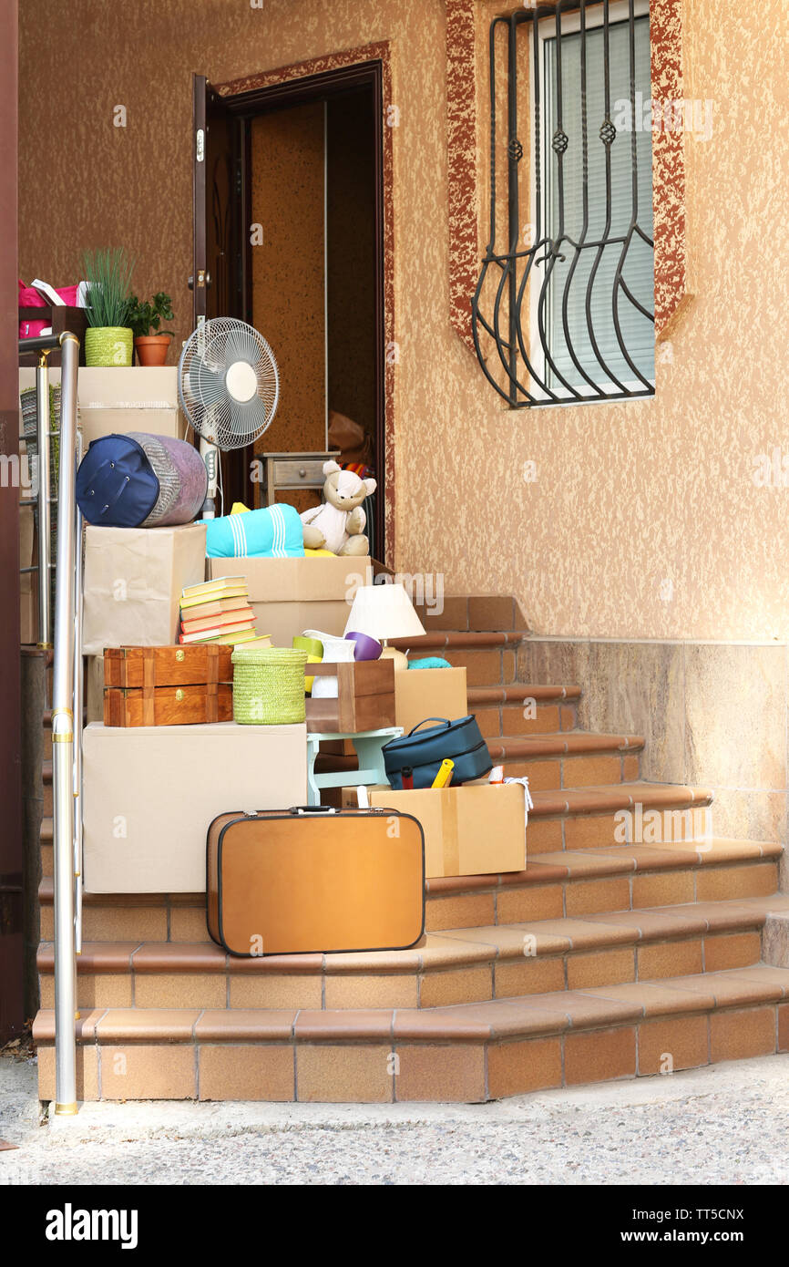 Moving boxes on stairs of new house, outdoors Stock Photo - Alamy