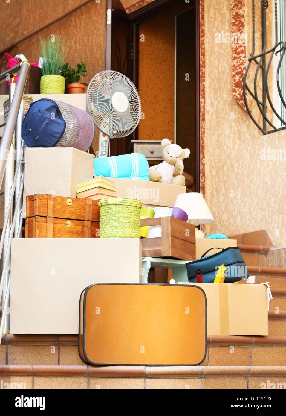 Moving boxes on stairs of new house, outdoors Stock Photo - Alamy