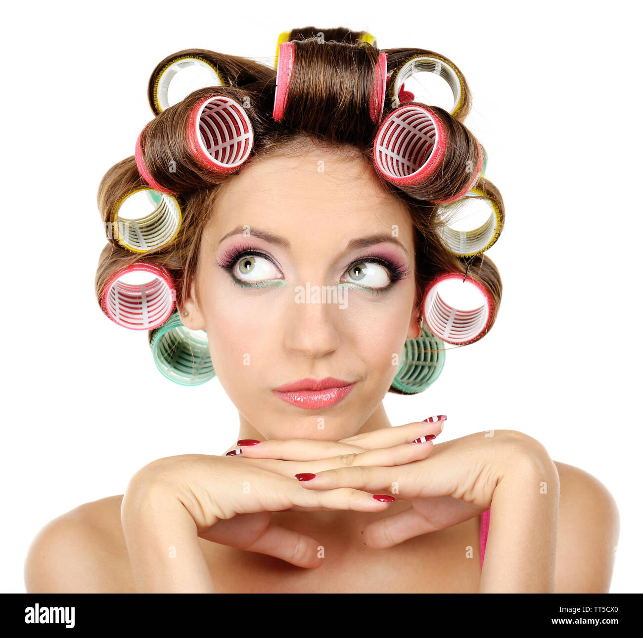 Beautiful girl in hair curlers isolated on white Stock Photo - Alamy