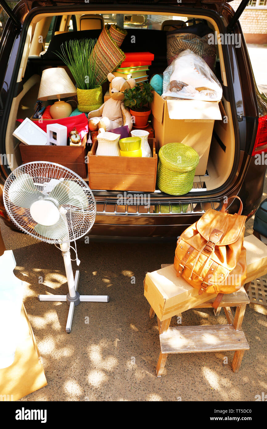 Moving boxes and suitcases in trunk of car, outdoors Stock Photo - Alamy