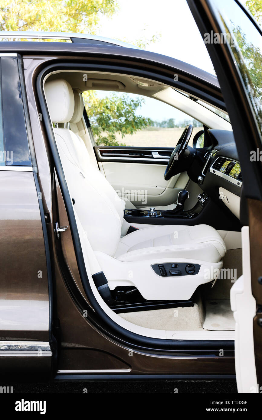 Modern car with open door, outdoors Stock Photo - Alamy