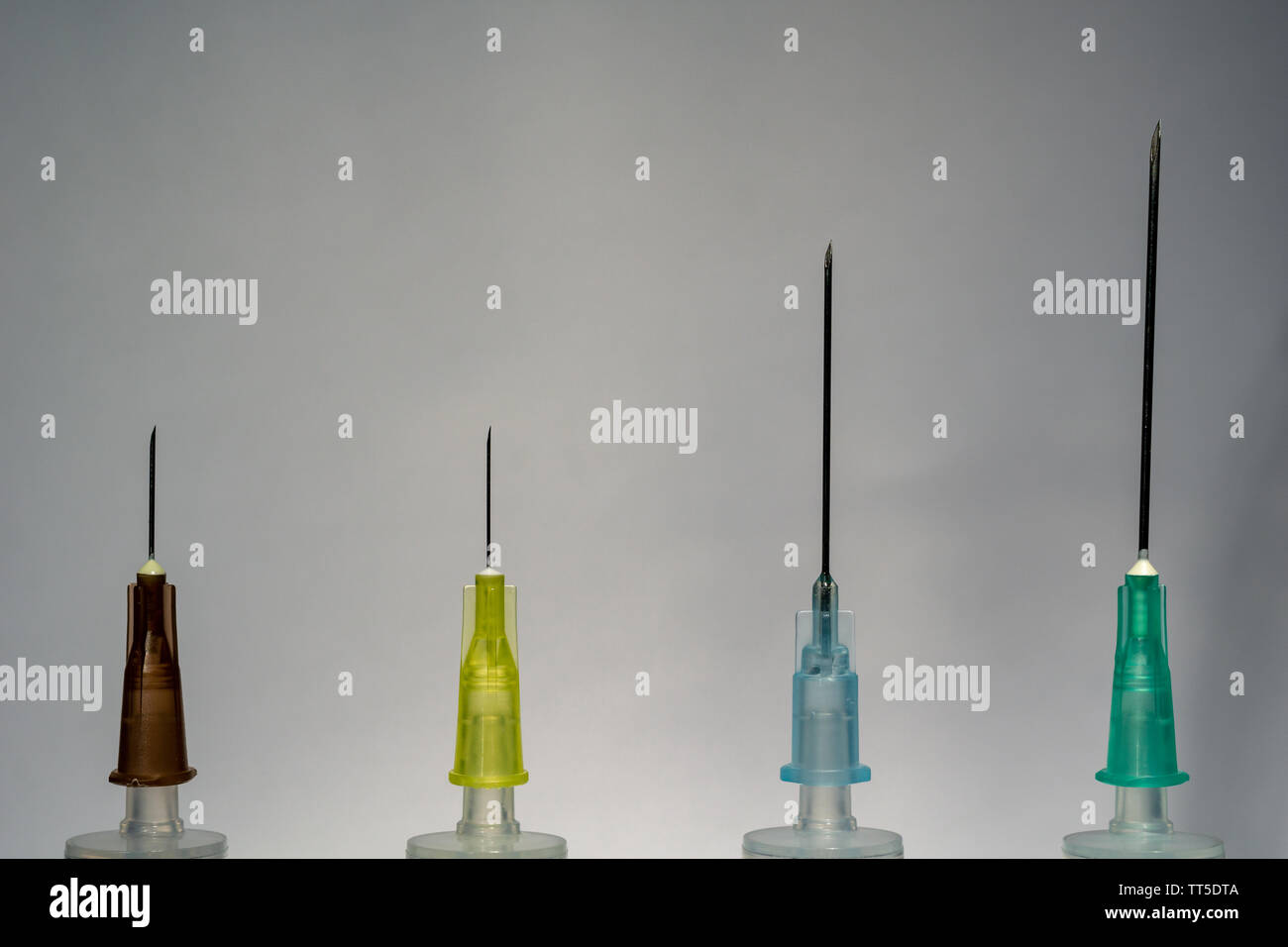 syringe needles on white background Stock Photo - Alamy