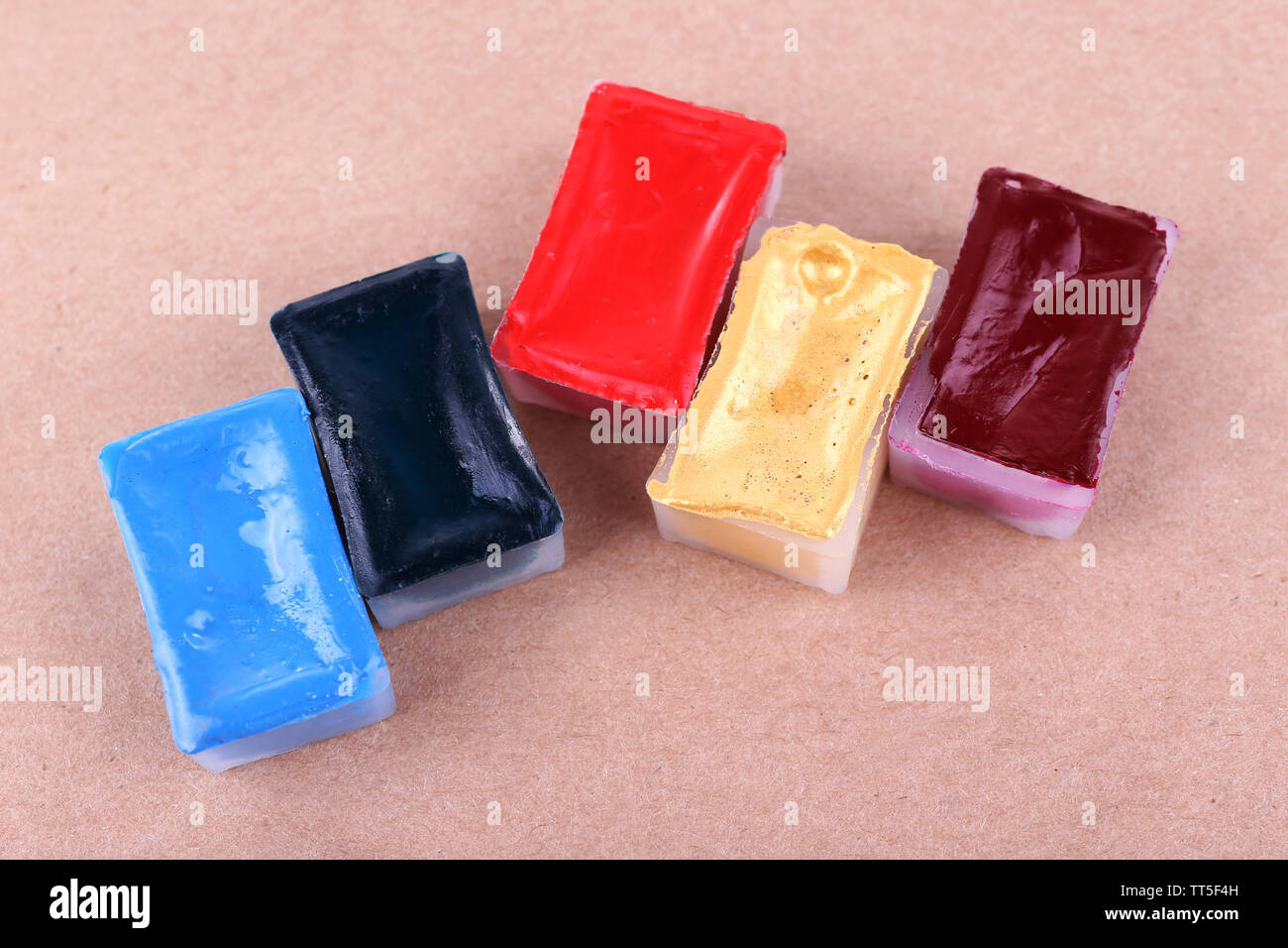 Watercolor paint cubes on beige background Stock Photo - Alamy