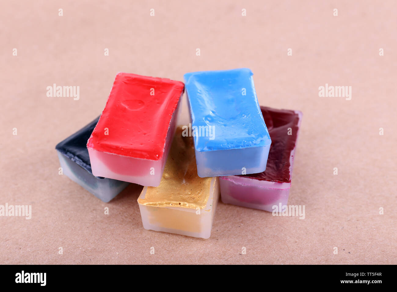 Watercolor paint cubes on beige background Stock Photo - Alamy