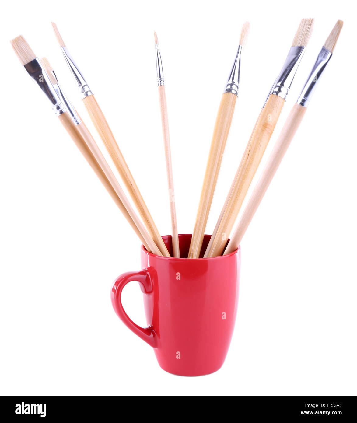 Paint brushes in red mug isolated on white Stock Photo - Alamy