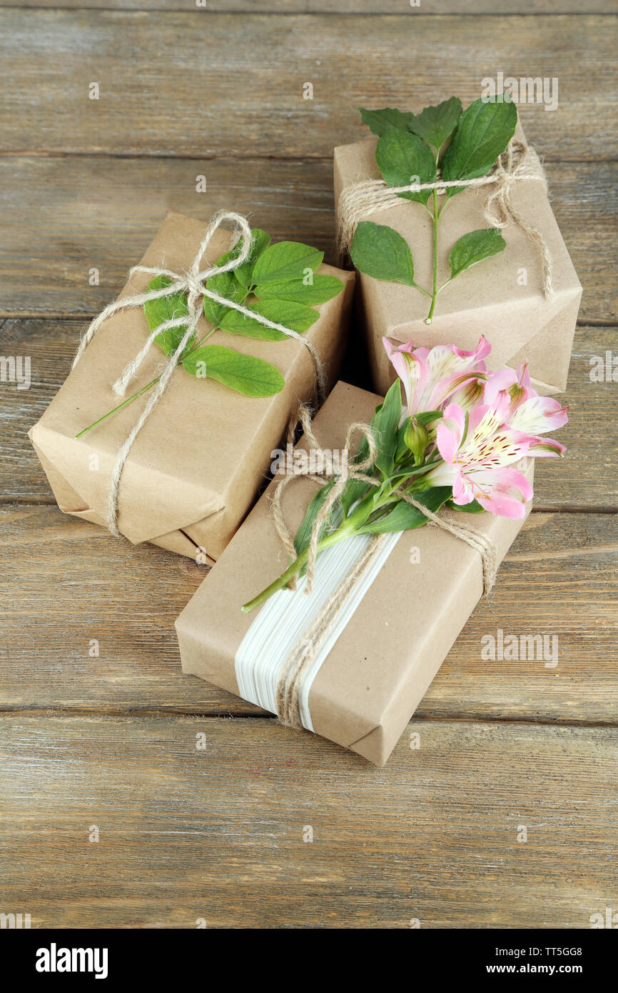 Natural style handcrafted gift boxes with fresh plants and rustic twine ...