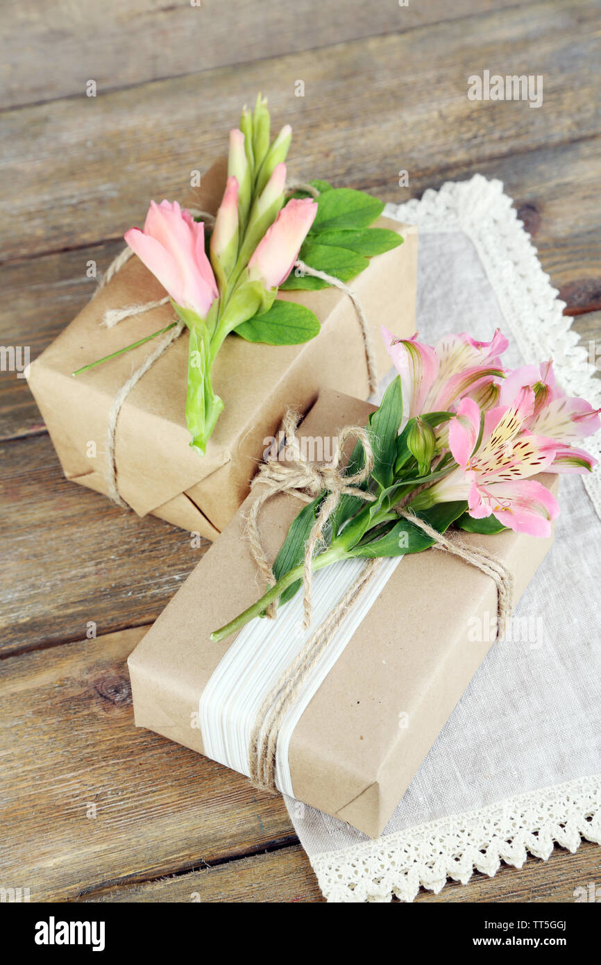 Natural style handcrafted gift boxes with fresh plants and rustic twine ...