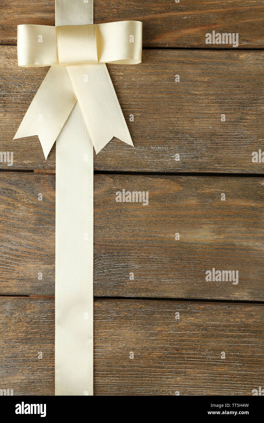 Old wooden background with beautiful bow Stock Photo - Alamy