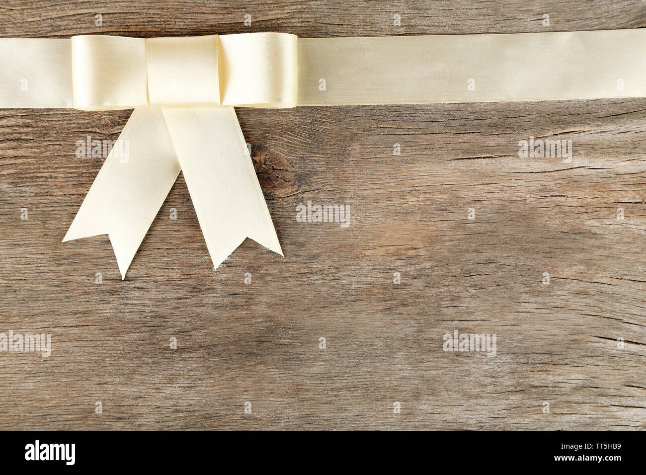Old wooden background with beautiful bow Stock Photo - Alamy