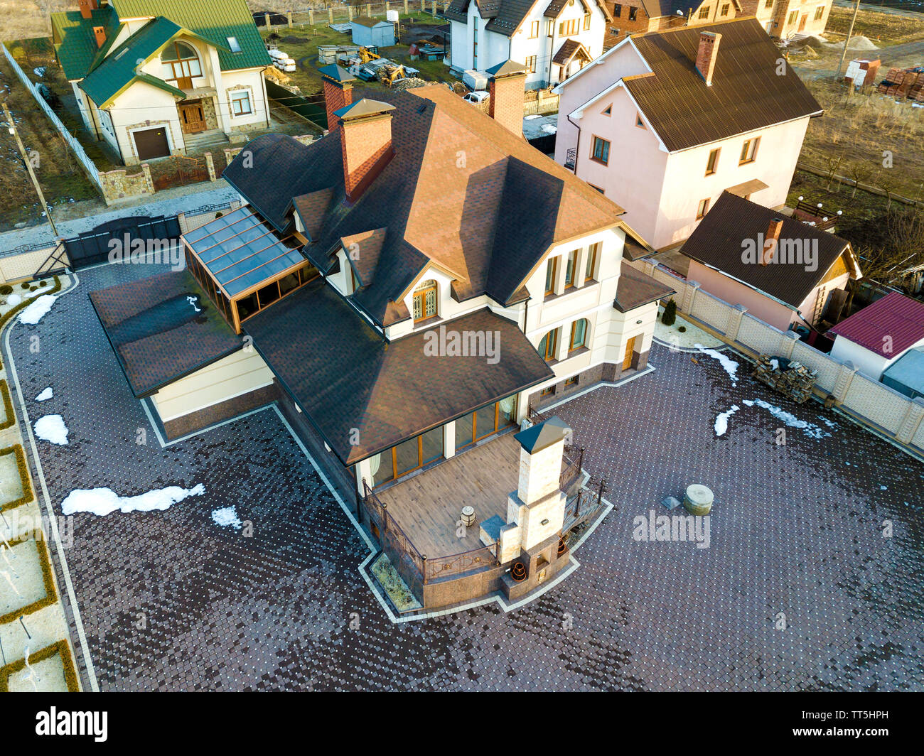 Aerial top view of new residential house cottage with shingle roof on ...