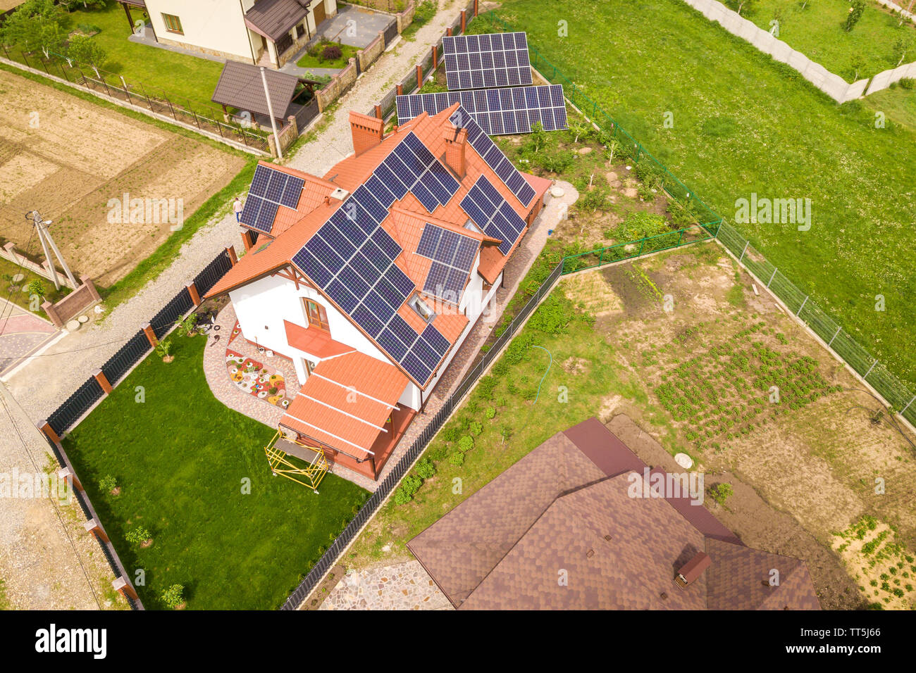 Aerial top view of new modern residential house cottage with blue shiny ...