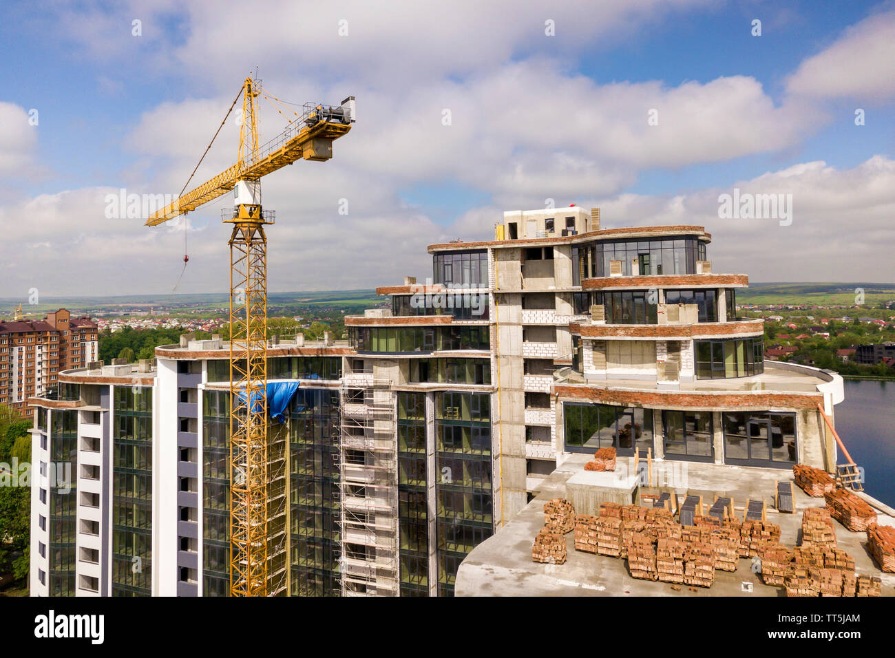 Apartment or office tall building under construction. Brick walls ...