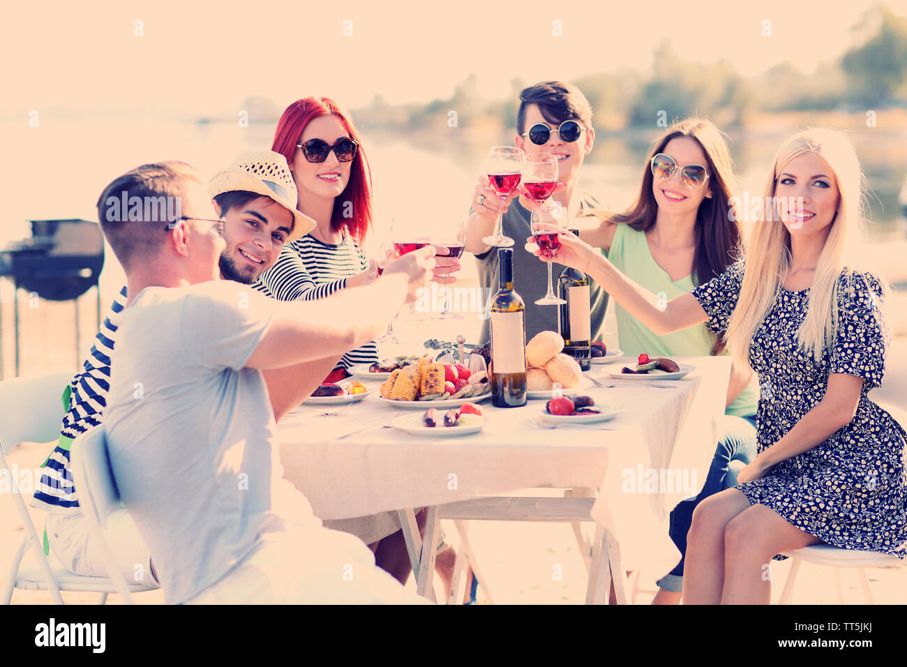 Happy friends on rest at beach Stock Photo - Alamy