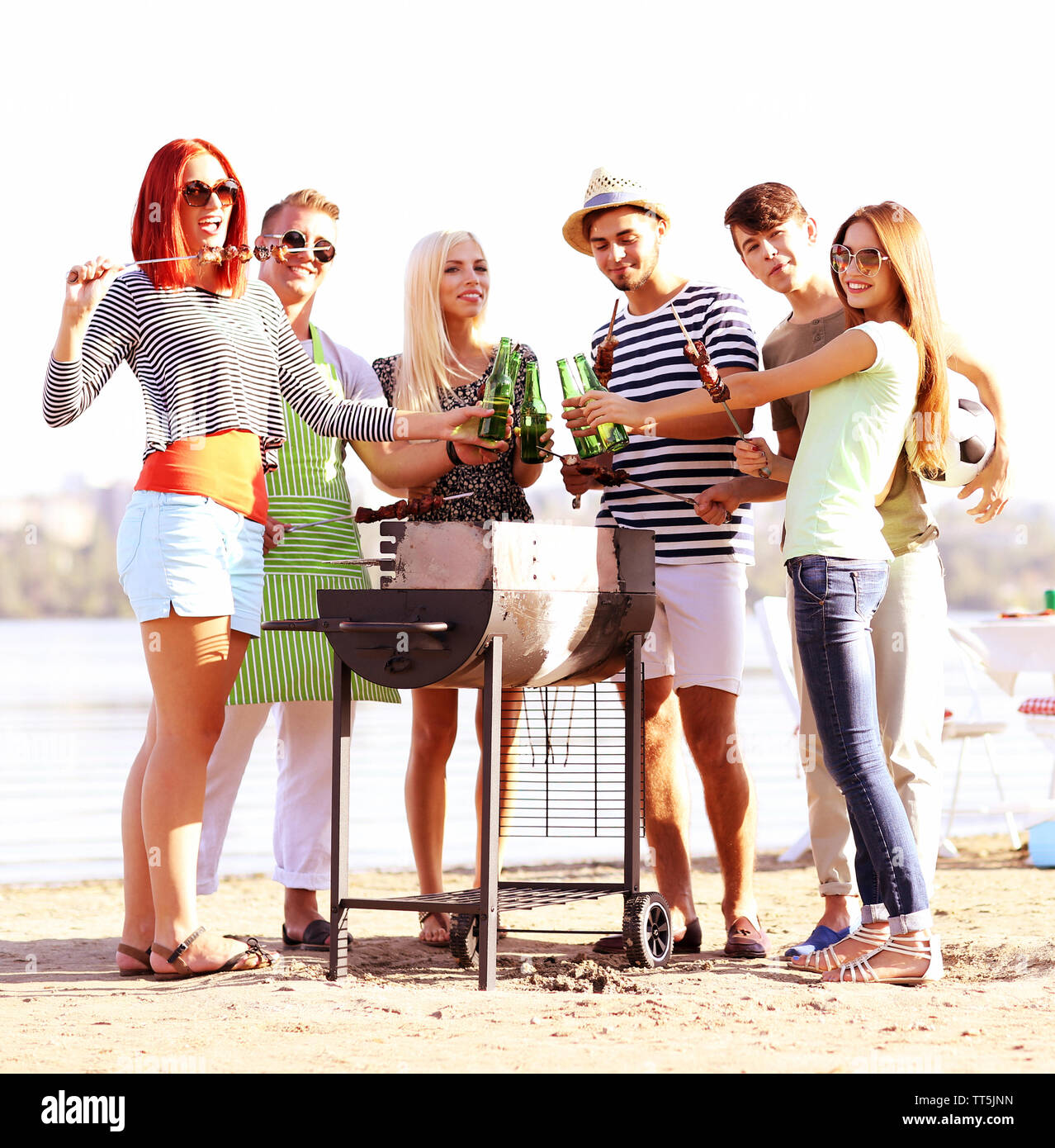 Happy friends on rest at beach Stock Photo - Alamy