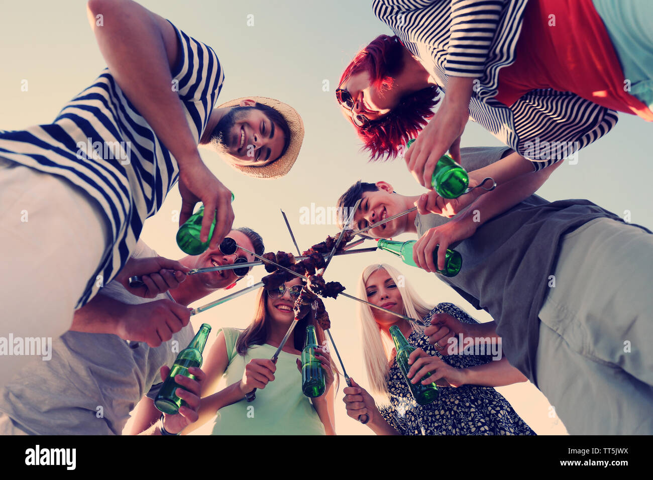 Happy friends on rest at beach Stock Photo - Alamy
