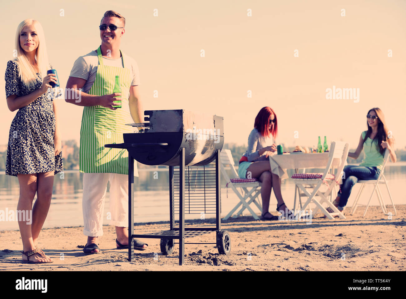 Happy friends on rest at beach Stock Photo - Alamy
