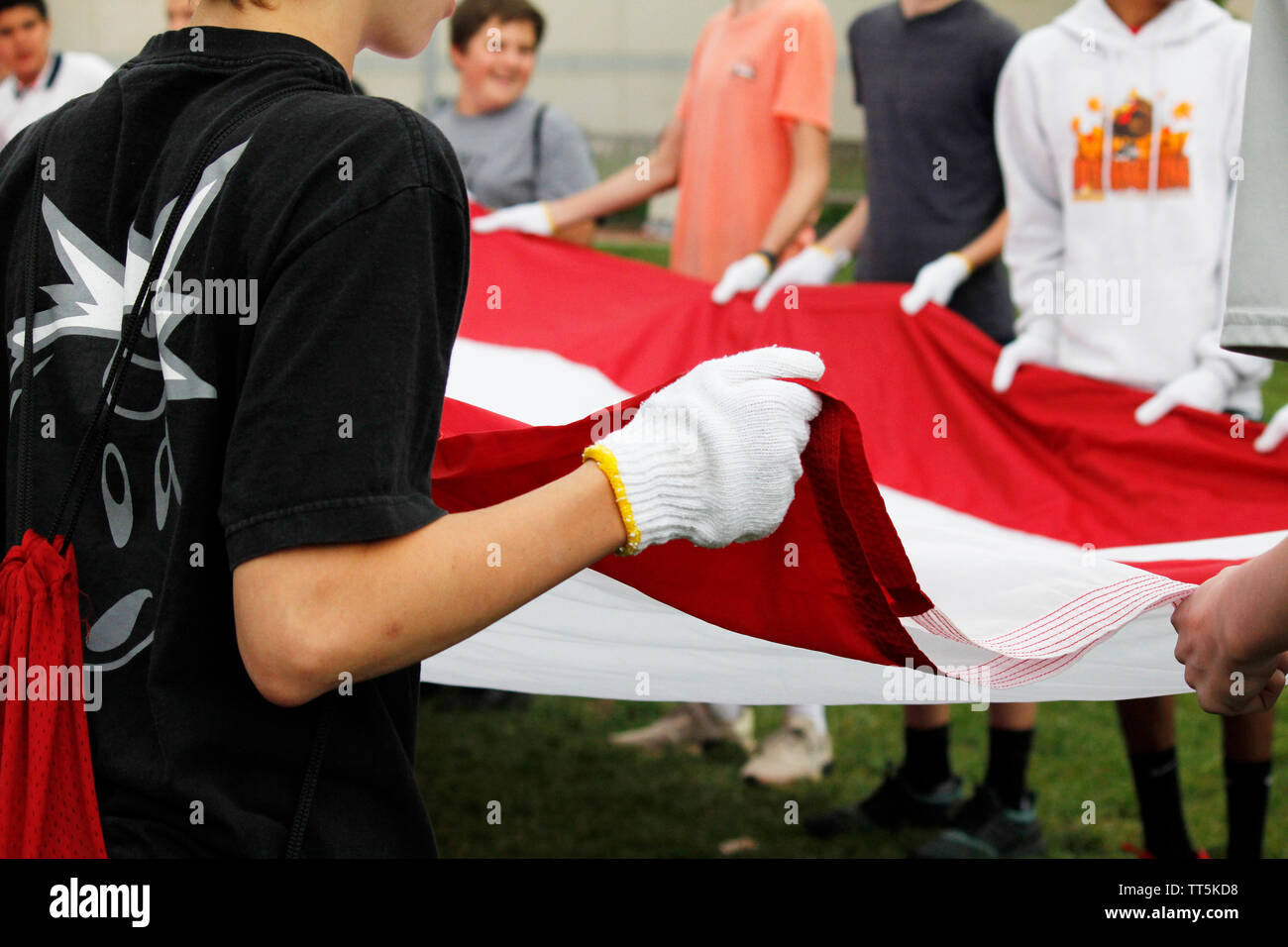 Philadelphia, PA, USA - June 14, 2019: Students work together to fold a ...