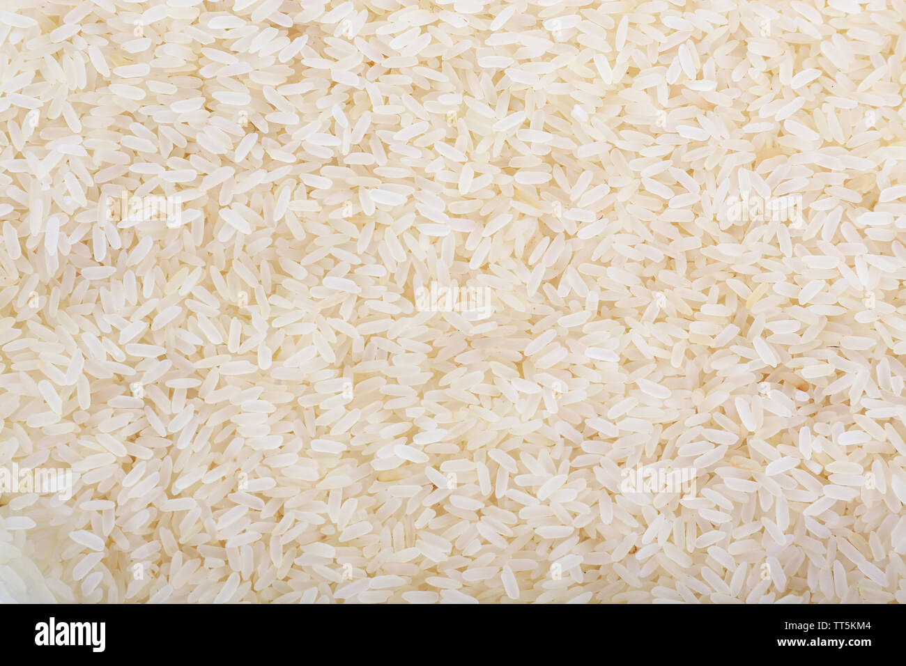 Rice as background Stock Photo - Alamy