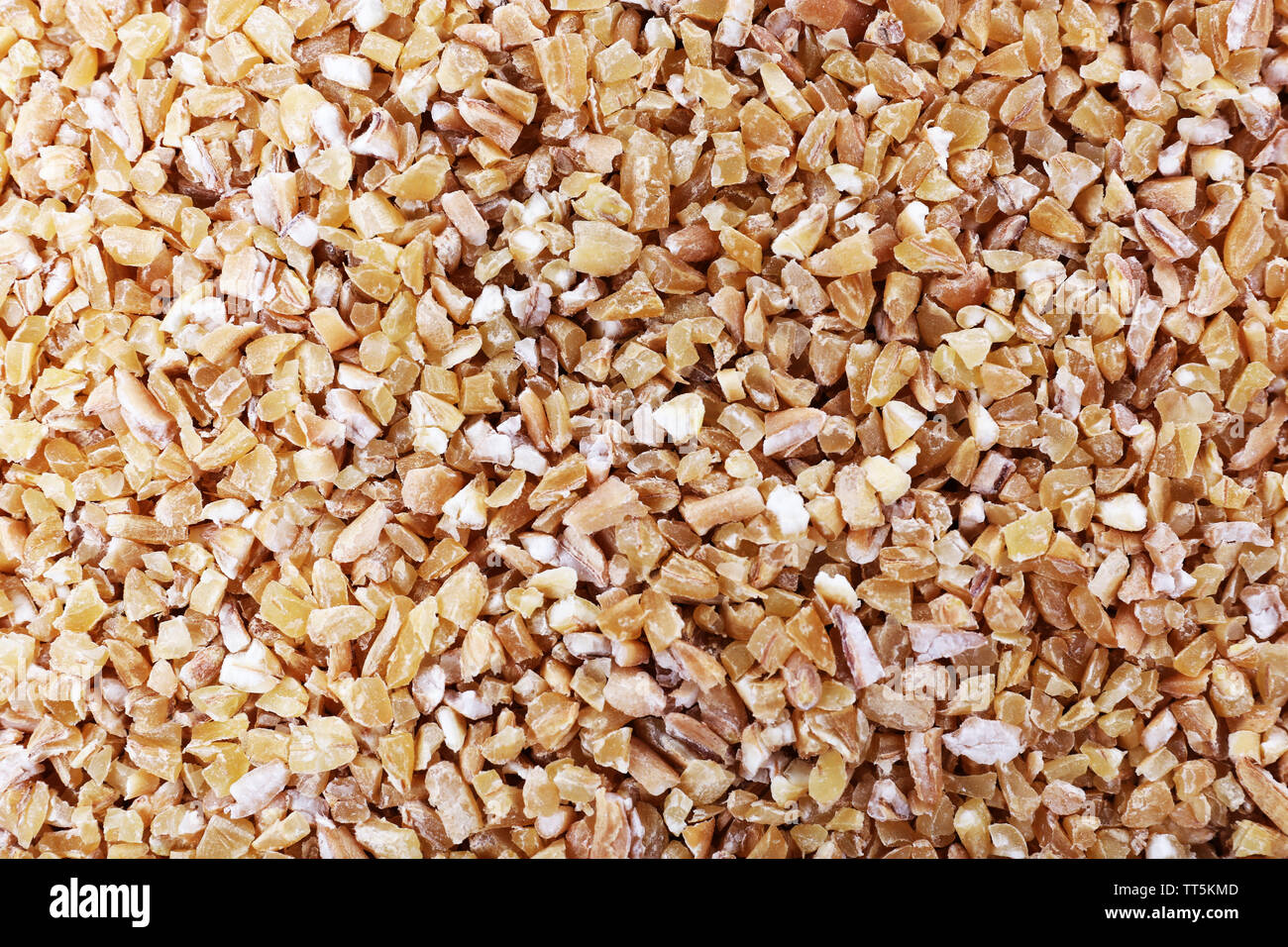 Wheat groats as background Stock Photo - Alamy