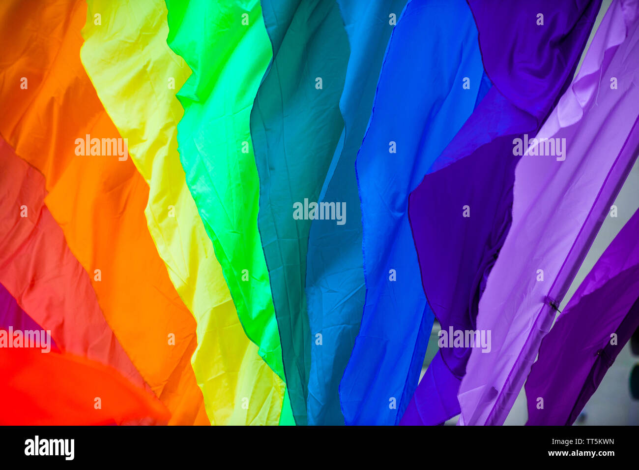 Rainbow flag parachute fabric fills the frame for a colorful background ...