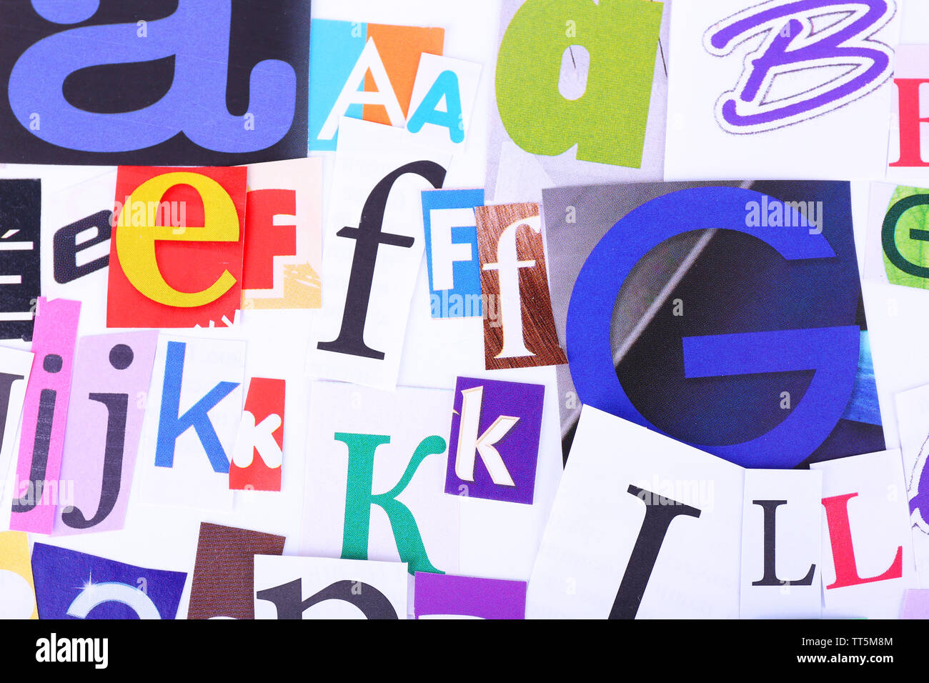 Colorful newspaper letters as background Stock Photo - Alamy