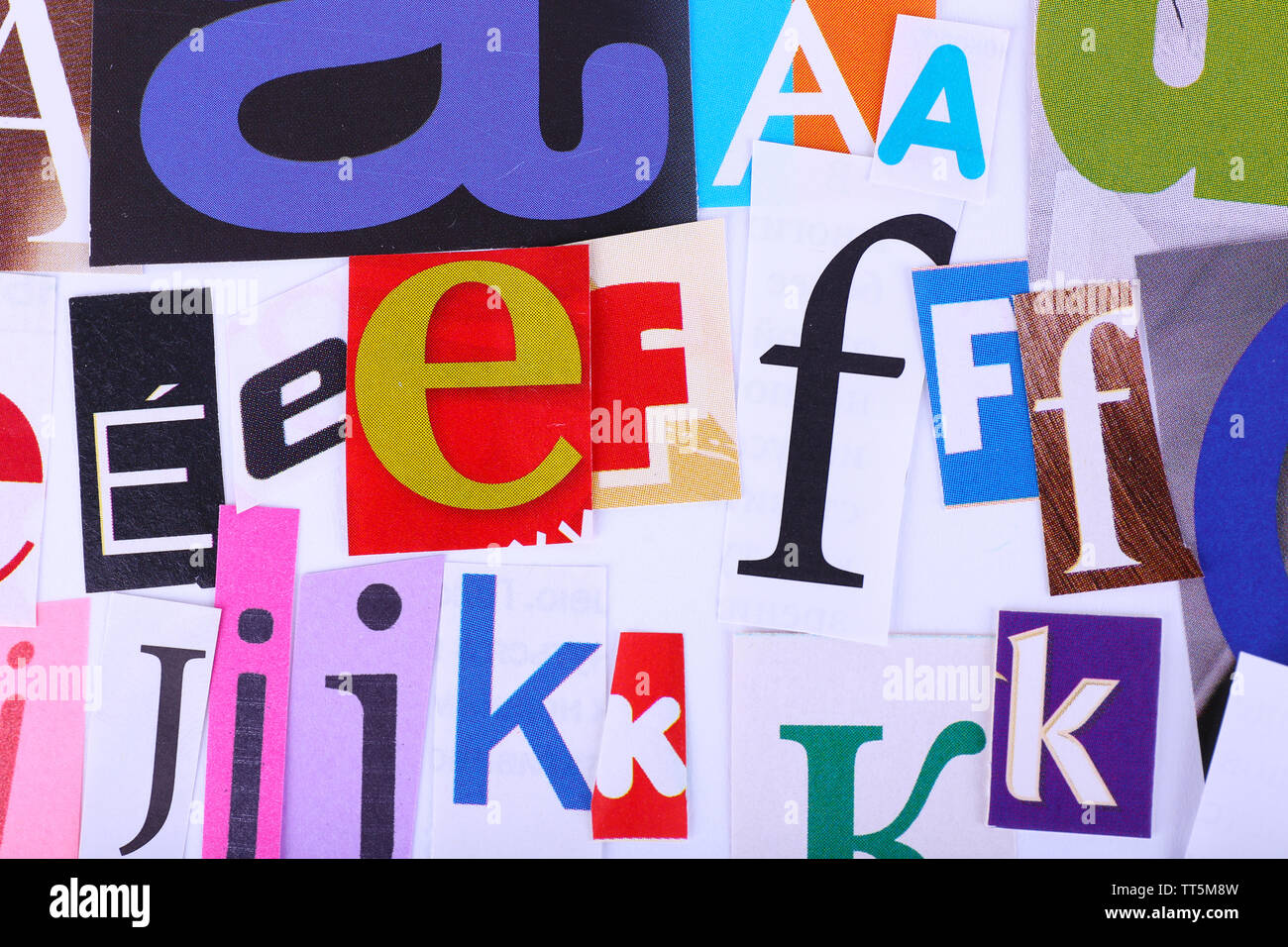 Colorful newspaper letters as background Stock Photo - Alamy