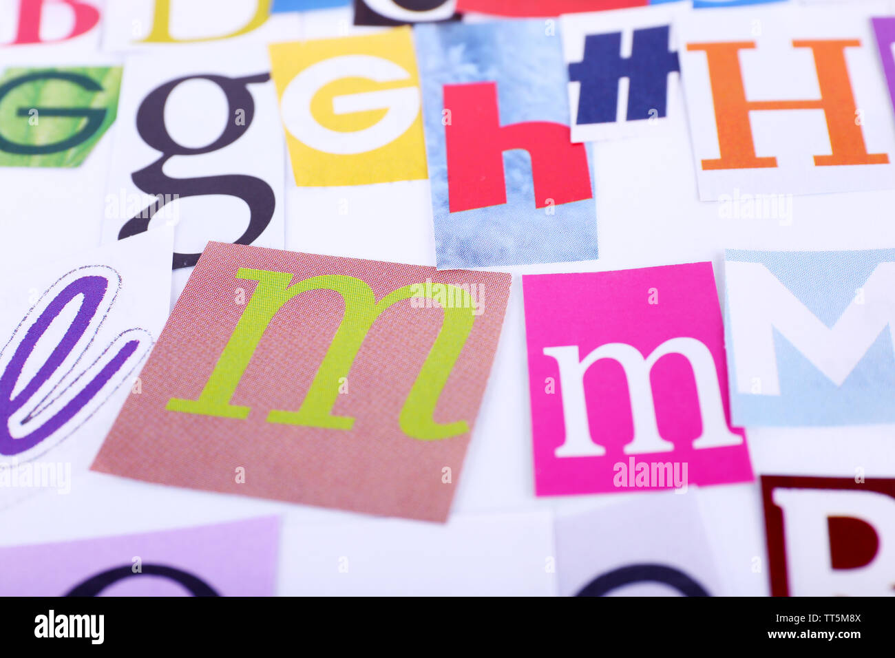 Colorful newspaper letters as background Stock Photo - Alamy