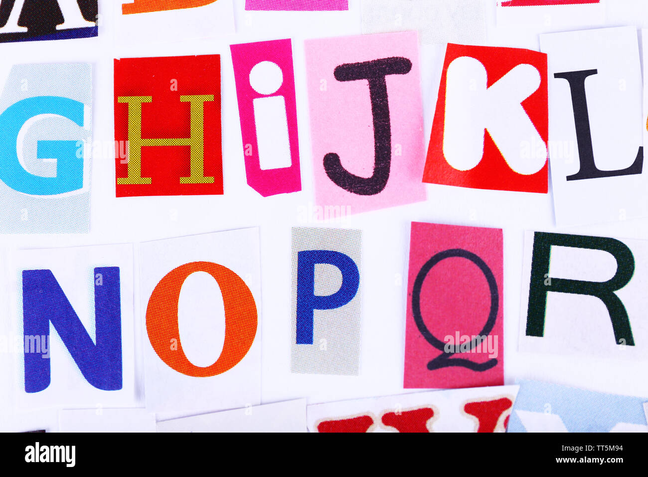 Colorful newspaper letters as background Stock Photo - Alamy