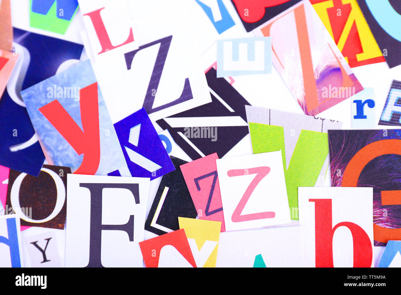 Colorful newspaper letters as background Stock Photo - Alamy