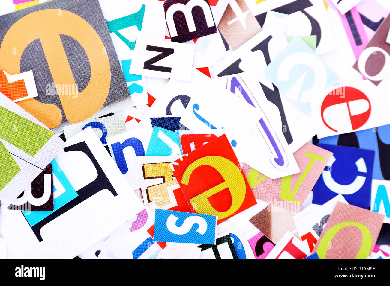 Colorful newspaper letters as background Stock Photo - Alamy