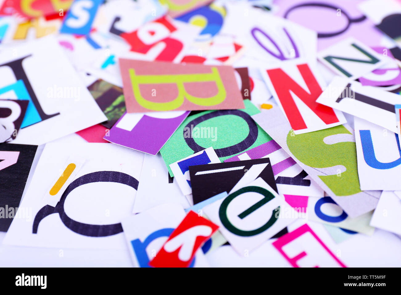 Colorful newspaper letters as background Stock Photo - Alamy