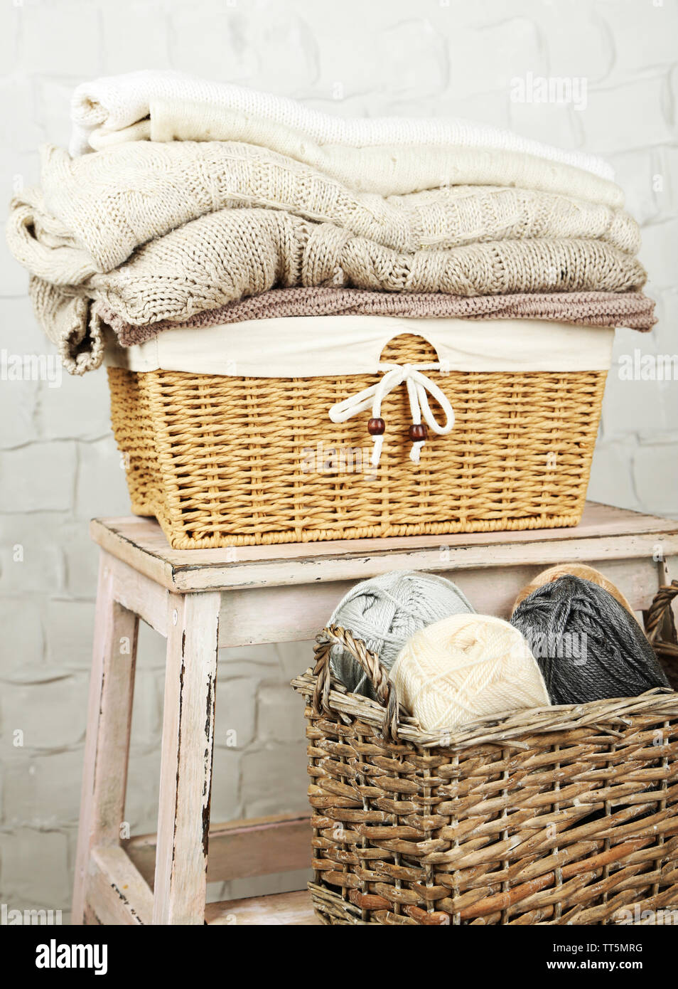 Still life with knitting clothes and yarn on wooden ladder Stock Photo ...