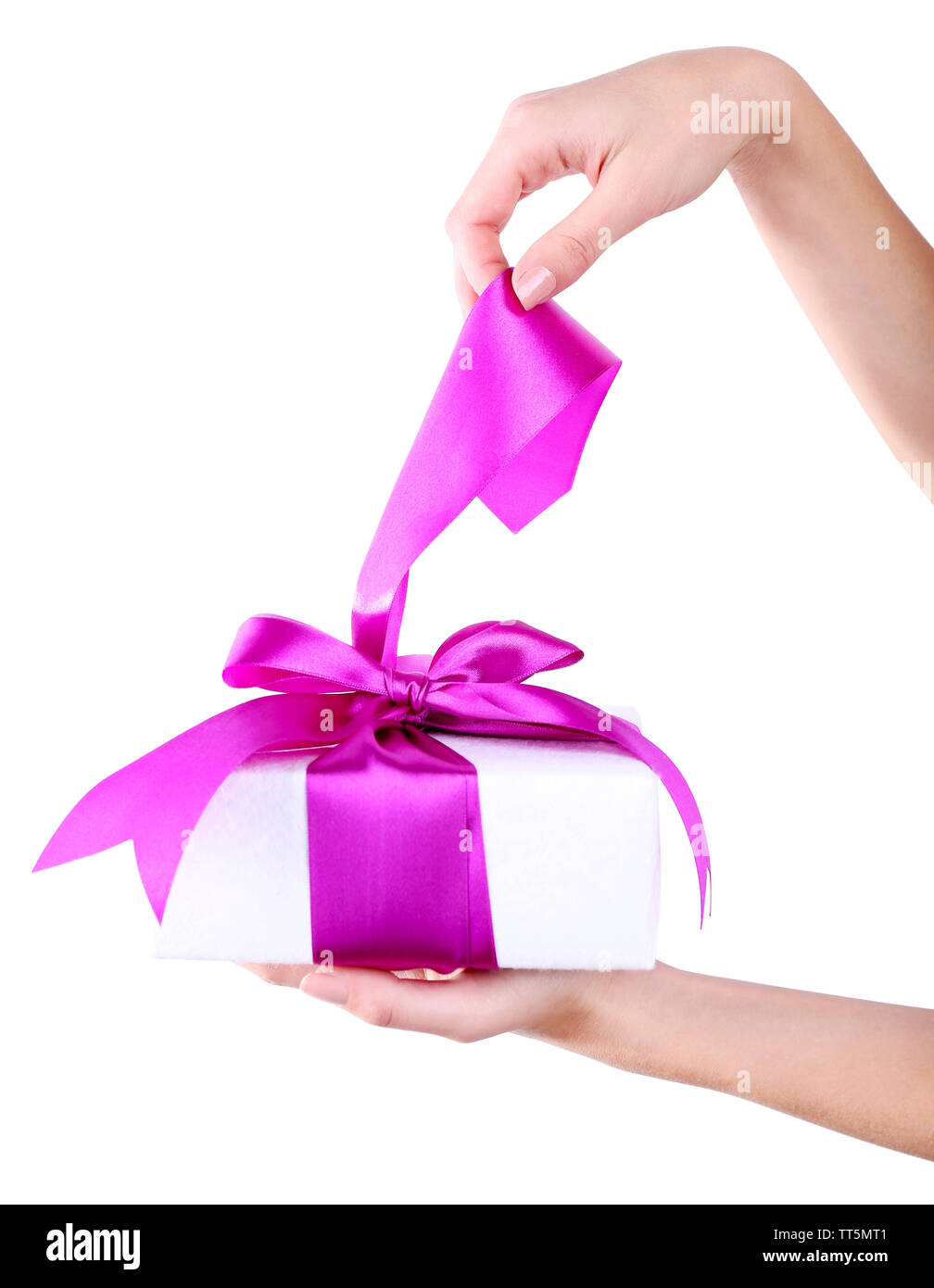 Hand holding a gift box with a purple ribbon hi-res stock photography ...