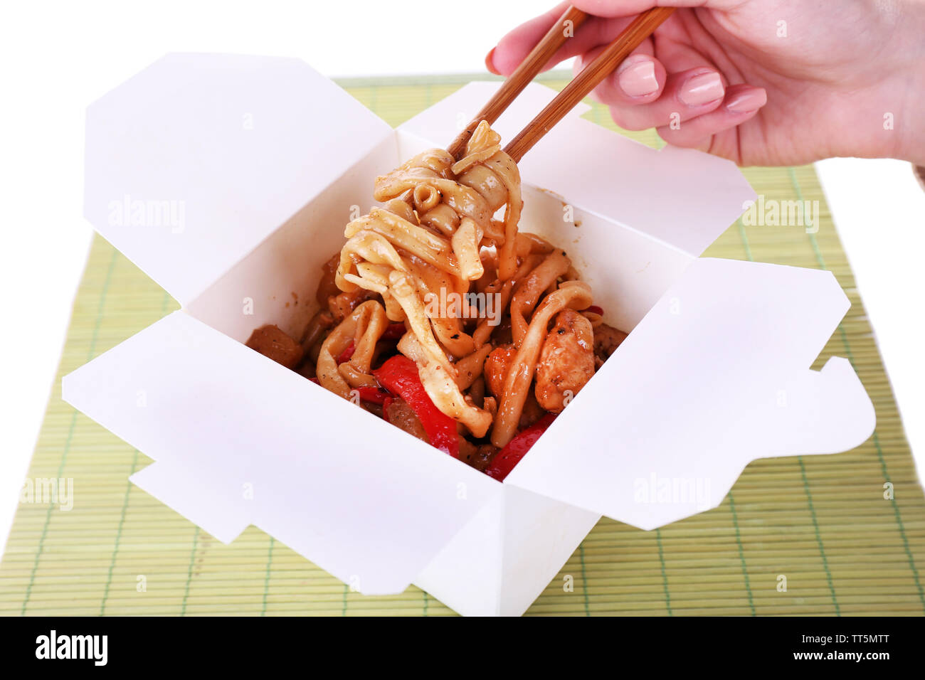 Fried noodle in takeaway box on mat on white background Stock Photo - Alamy