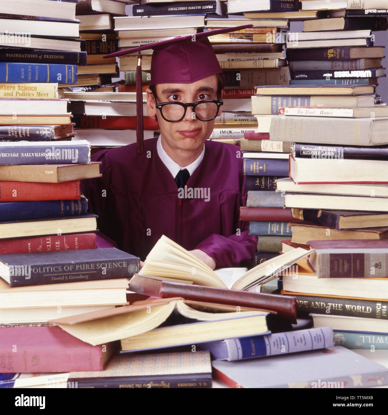 Surrounded by books hi-res stock photography and images - Alamy