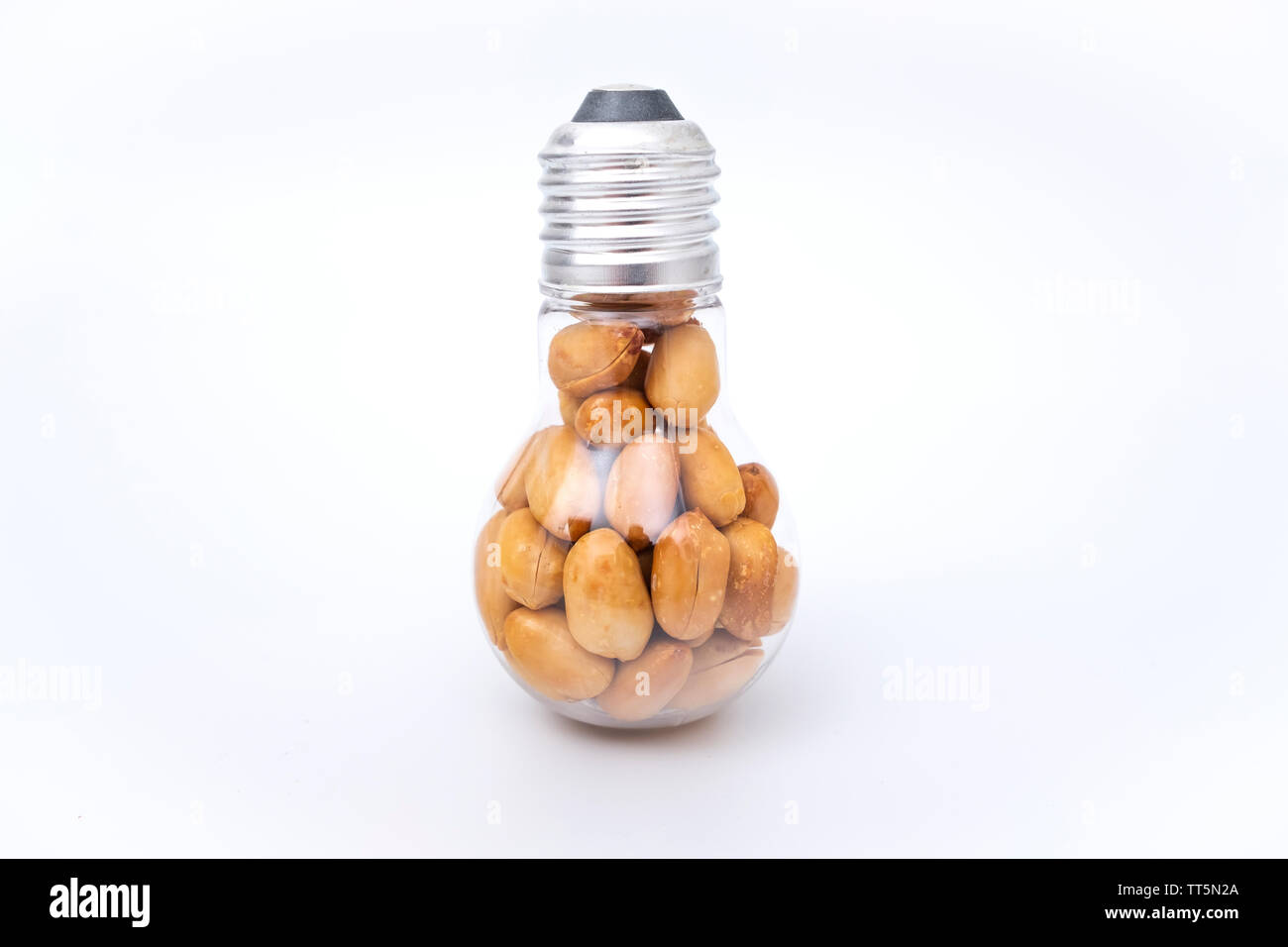 Peanuts in light bulb, peanut idea concept Stock Photo - Alamy