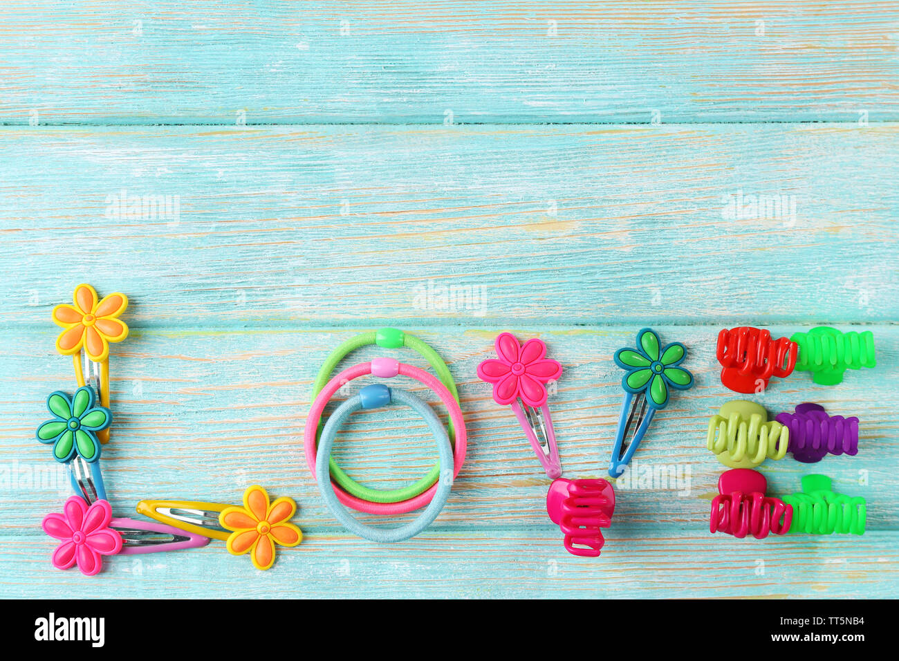 Love word formed with colorful scrunchies on wooden background Stock ...