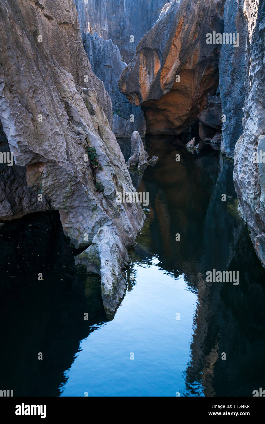 Lake among tall rocks formations of limestone, The Stone Forest, Shilin ...